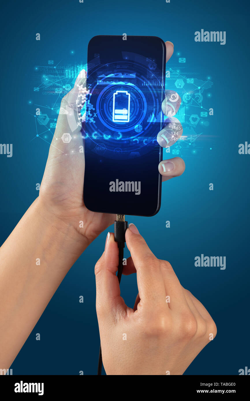 Elegant hand charging smartphone with global report concept Stock Photo ...