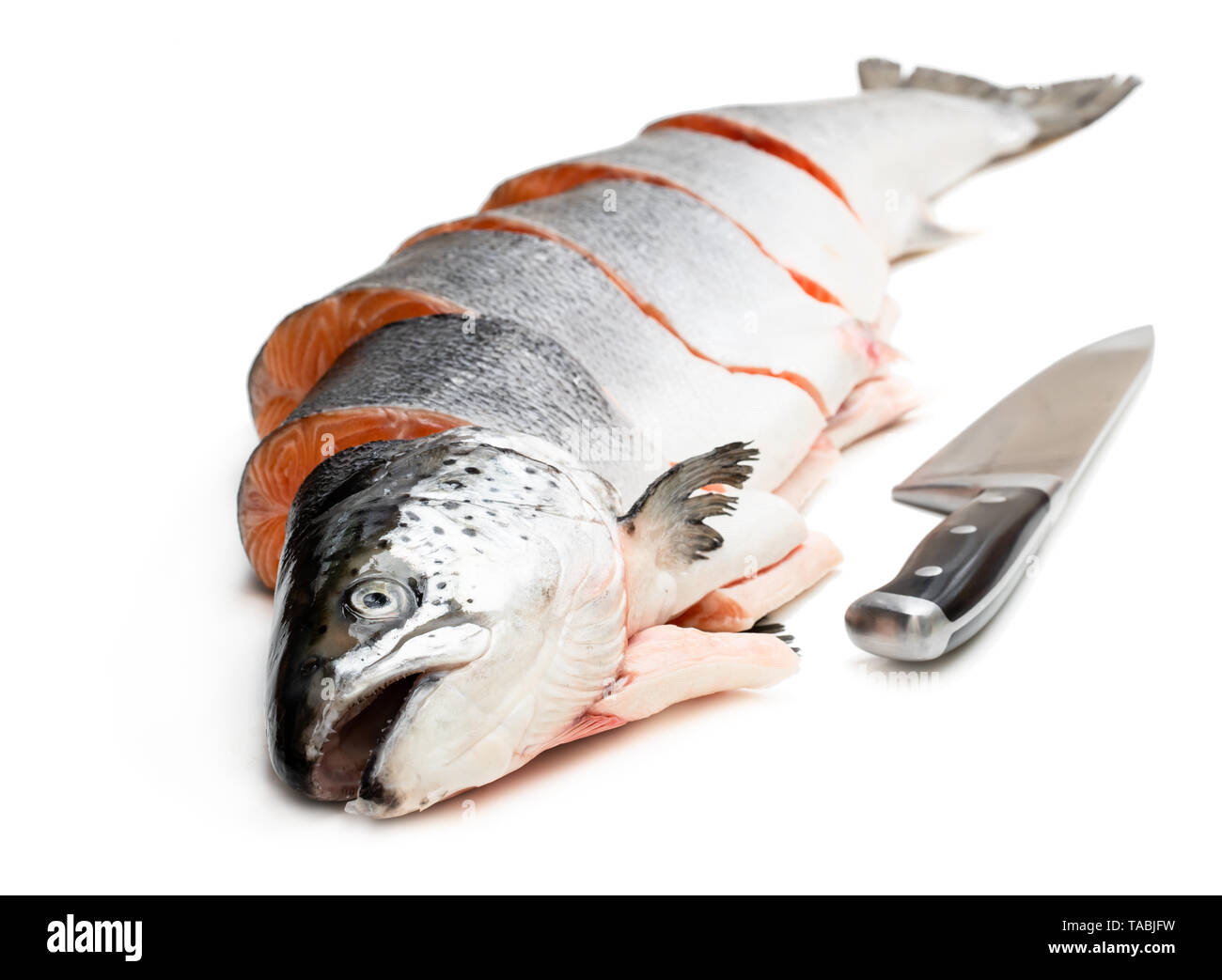 Fresh whole raw salmon cut into slices isolated on white Stock Photo ...
