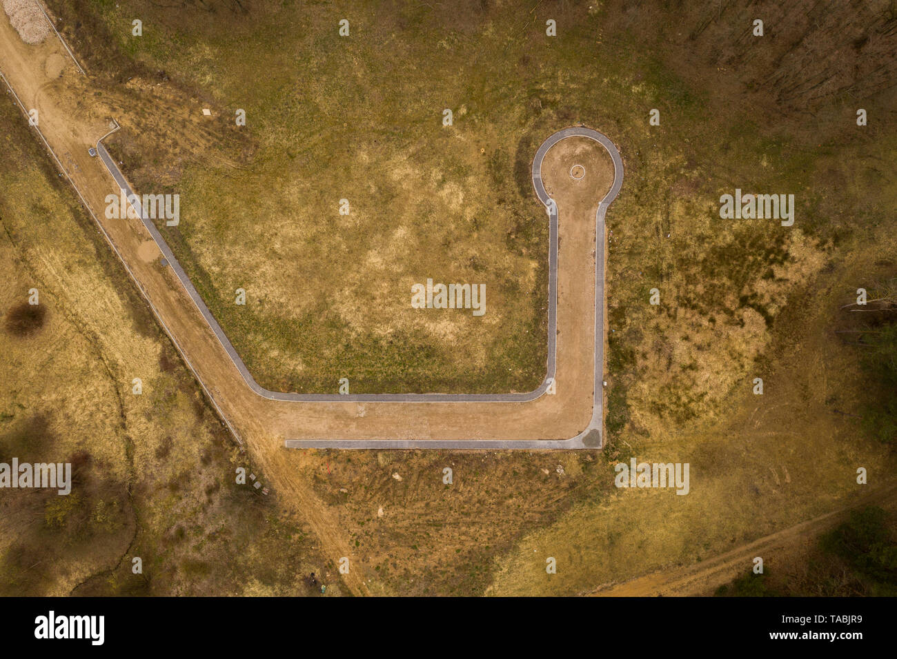 Aerial view of dirt road and roundabout in winter on sunny day Stock ...
