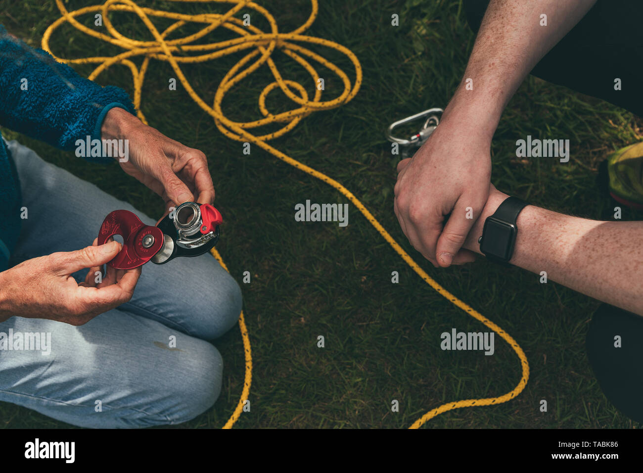 Two men adjusting hi-res stock photography and images - Alamy