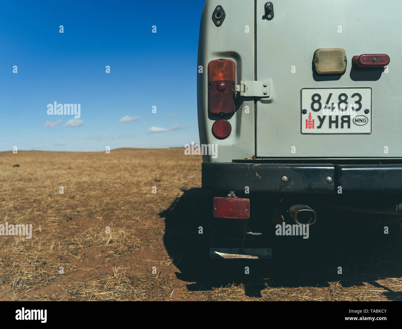 Low angle rear view of sport utility van against a blue sky Stock Photo ...