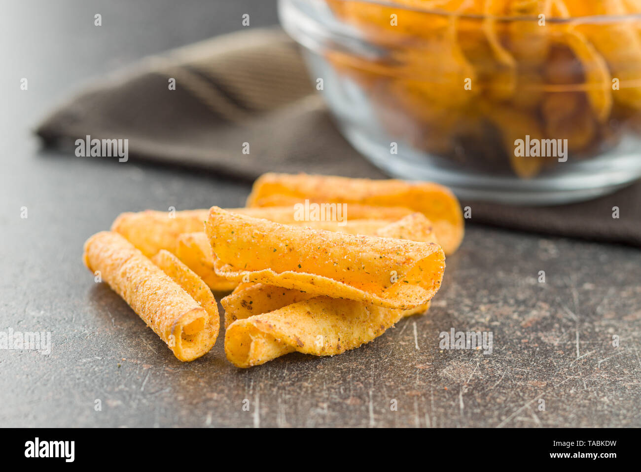 Rolled tortilla chips on old kitchen table Stock Photo - Alamy