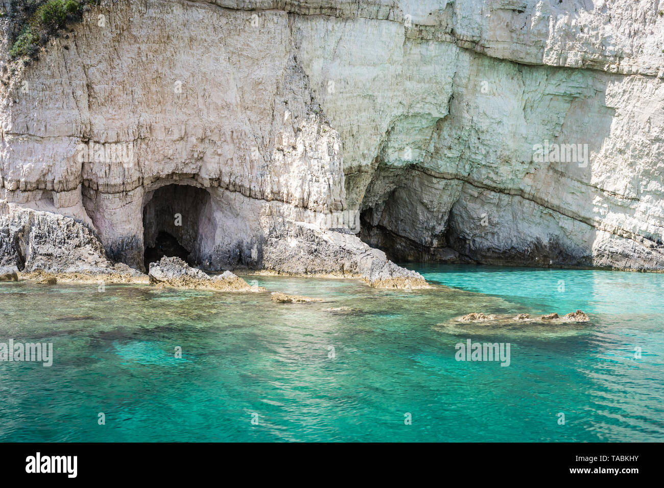 Turquoise water under Blue Caves in Zante Island, Greece Stock Photo ...