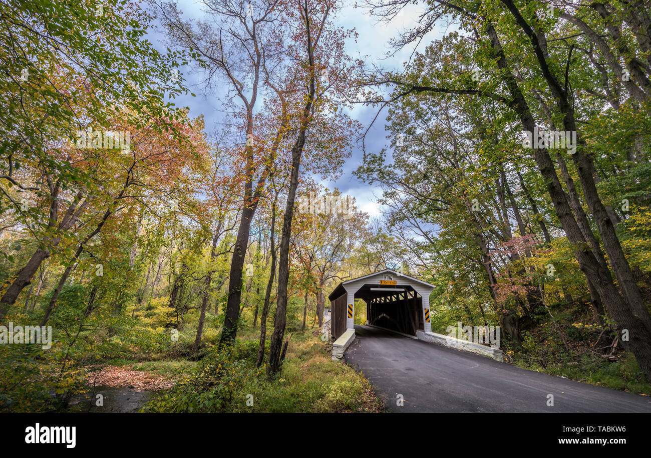 Rustic old covered bridge in the rural Pennsylvania countryside during ...