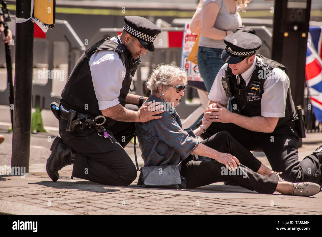 Police helping old lady hi-res stock photography and images - Alamy