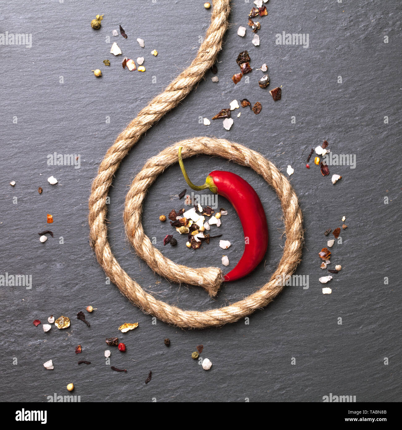 red chili pepper with a rope Stock Photo - Alamy