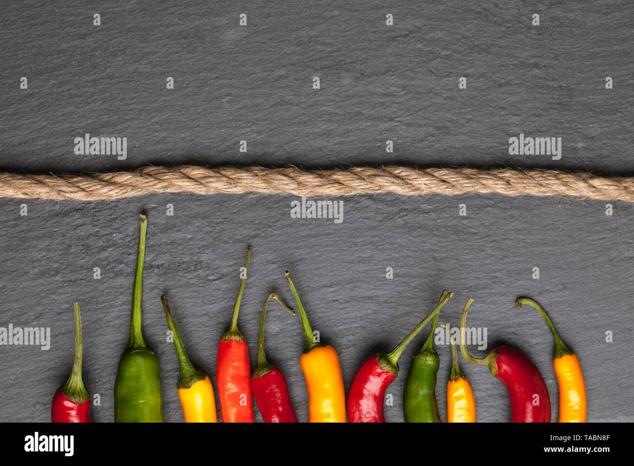 chalk board background with colorful chili peppers Stock Photo - Alamy