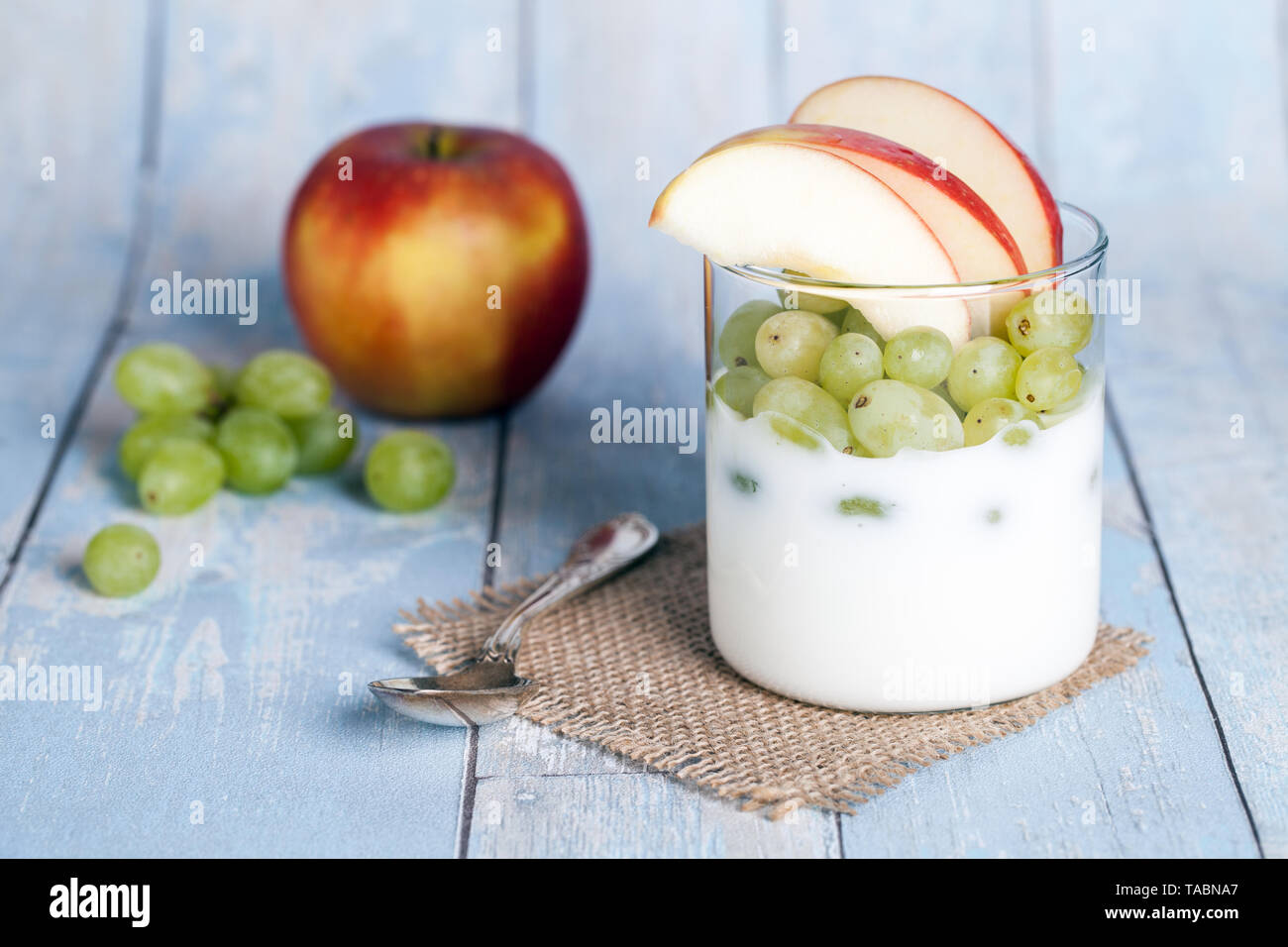 yogurt with apples and grapes Stock Photo - Alamy