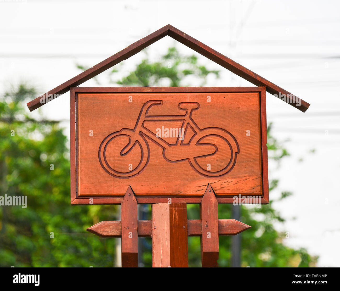 bicycle lane sign / Wooden sign bike on the road in public park Stock ...