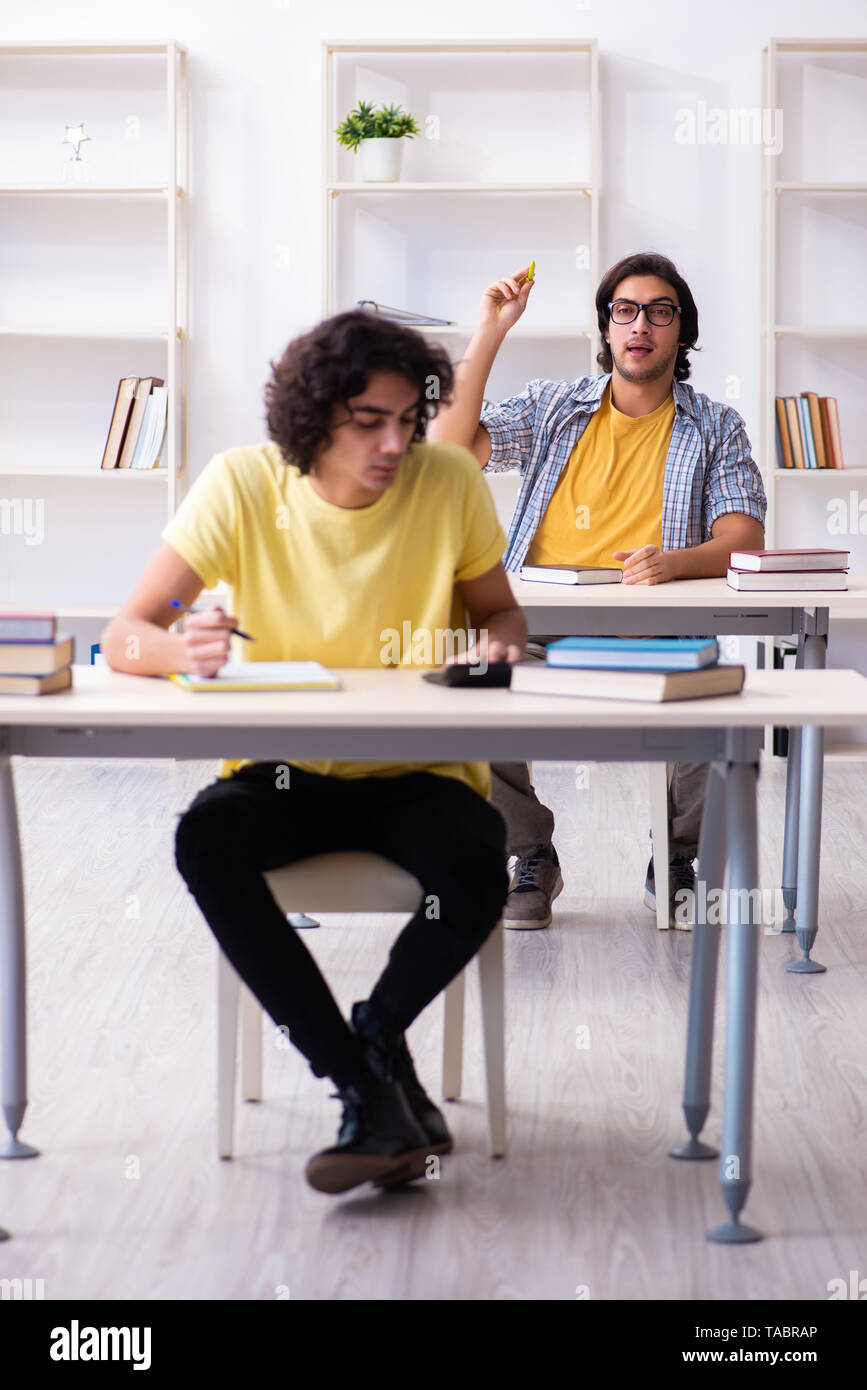 Two male students in the classroom Stock Photo - Alamy