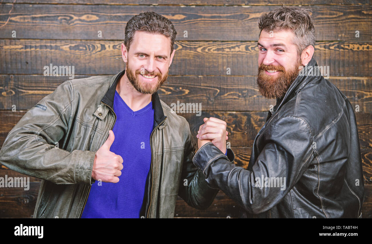 Friendship of brutal guys. Handshake symbol of successful deal ...