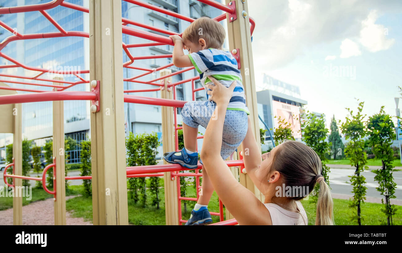 3 children climbing ladder hi-res stock photography and images - Alamy