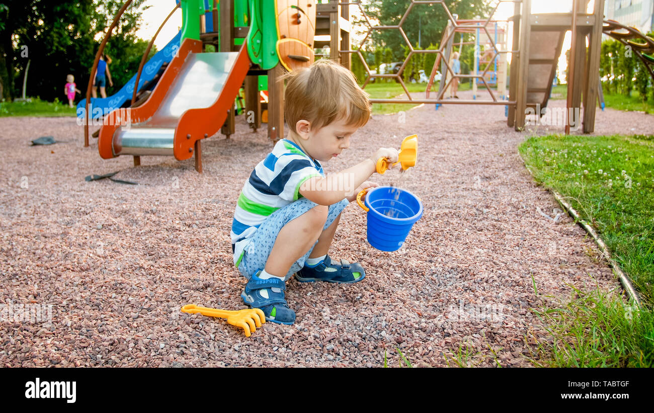 Child boy digging sand on hi-res stock photography and images - Alamy