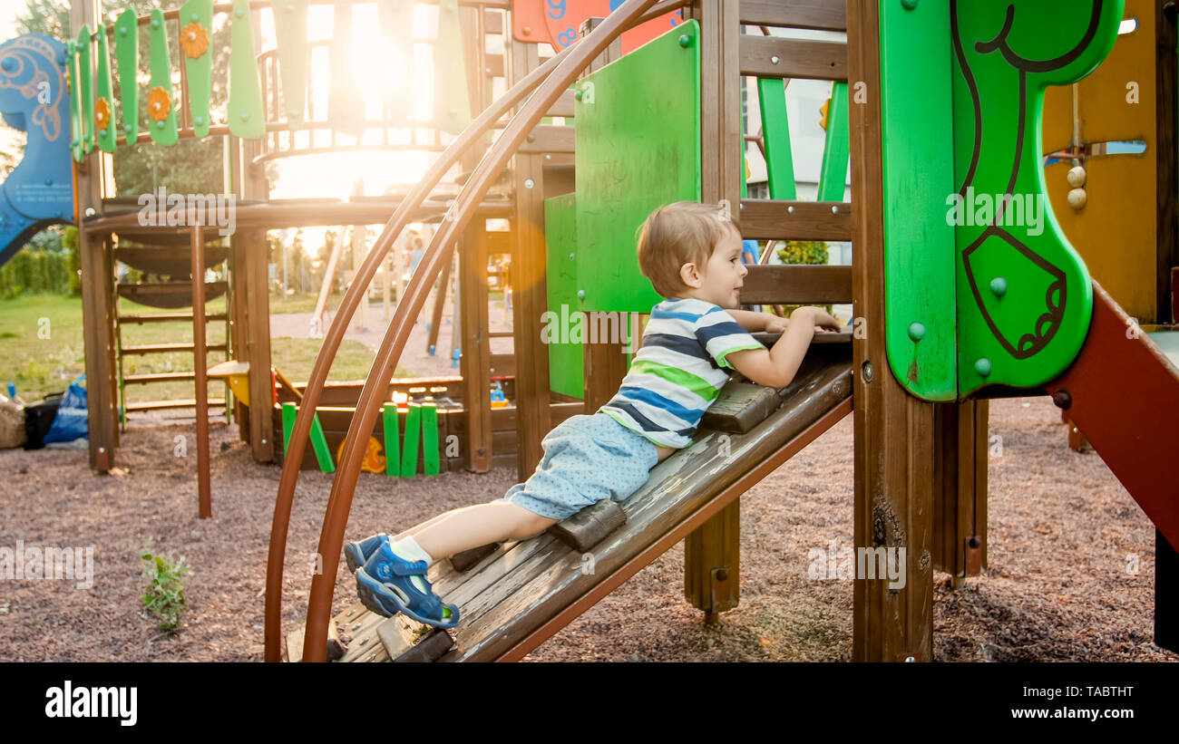 3 children climbing ladder hi-res stock photography and images - Alamy