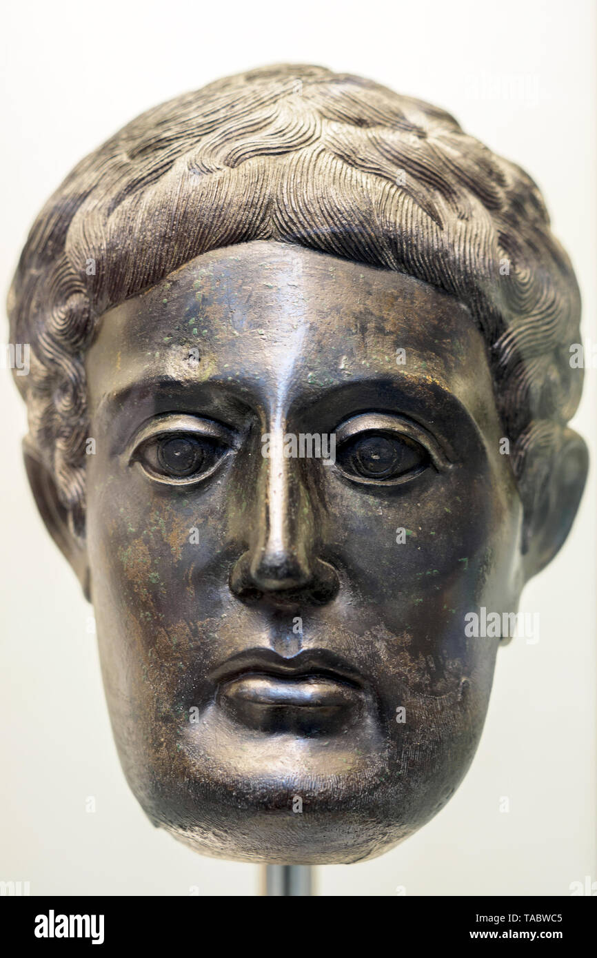 Bronze head of a young man from a life-sized statue Etruscan, about 375 ...