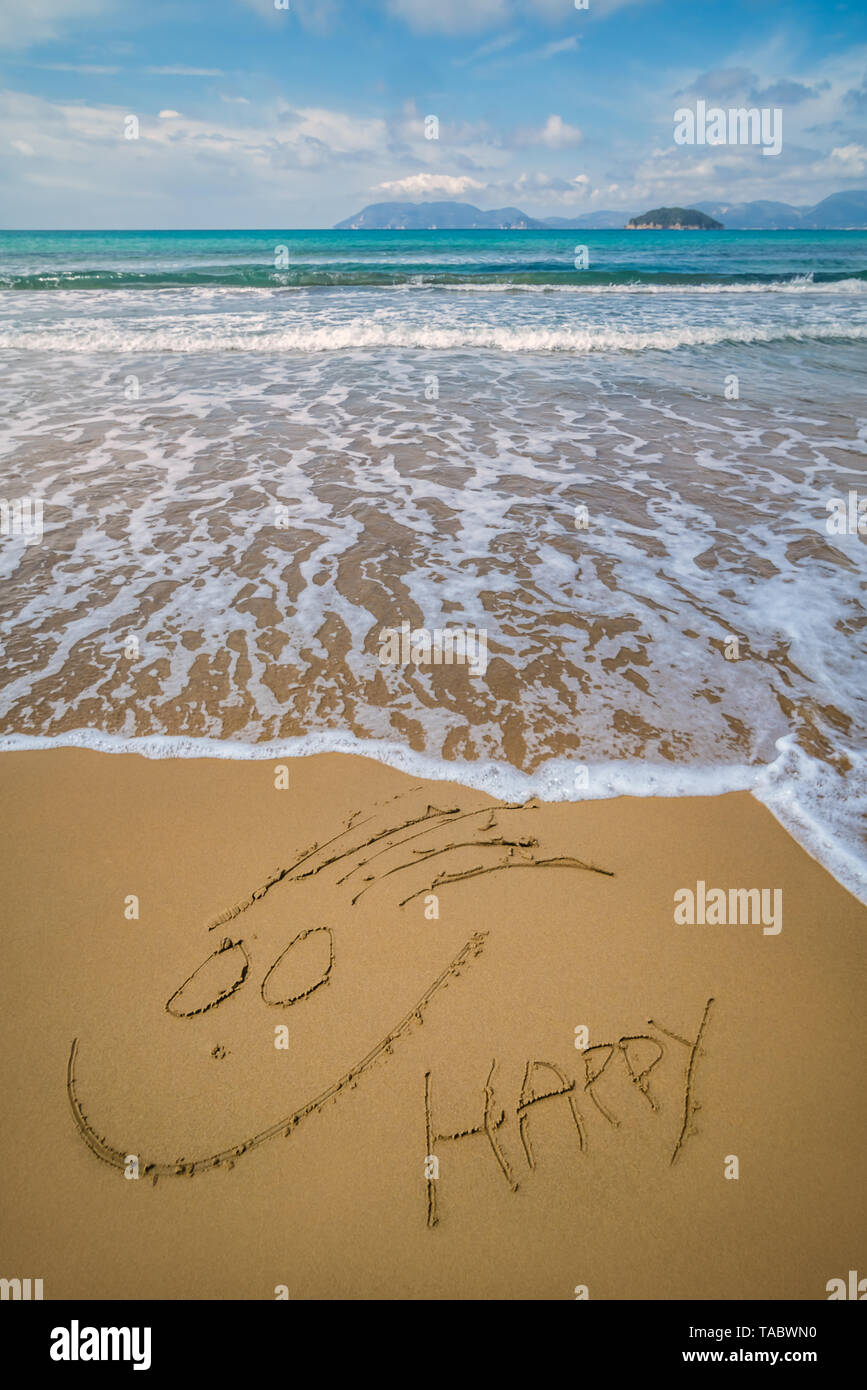 Smiley face in sand hi-res stock photography and images - Alamy