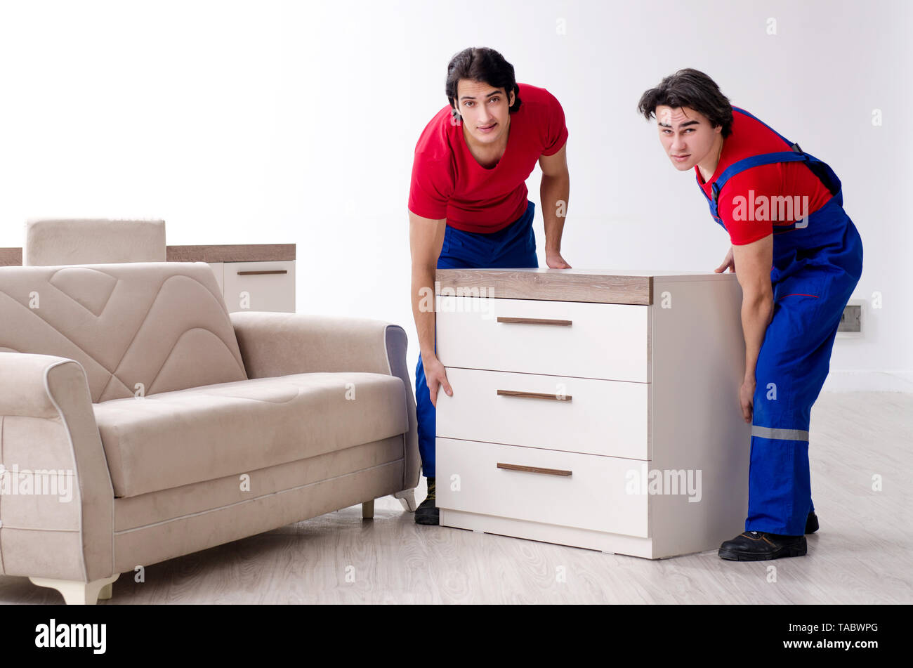 Male employees moving service hi-res stock photography and images - Alamy