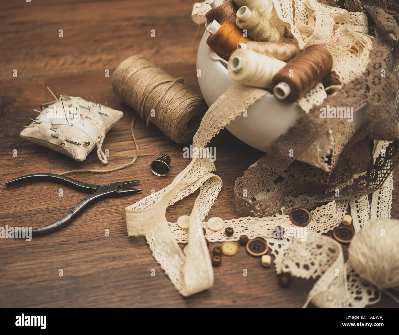 Sewing concept. Thread spools, buttons and sewing needles Stock Photo ...