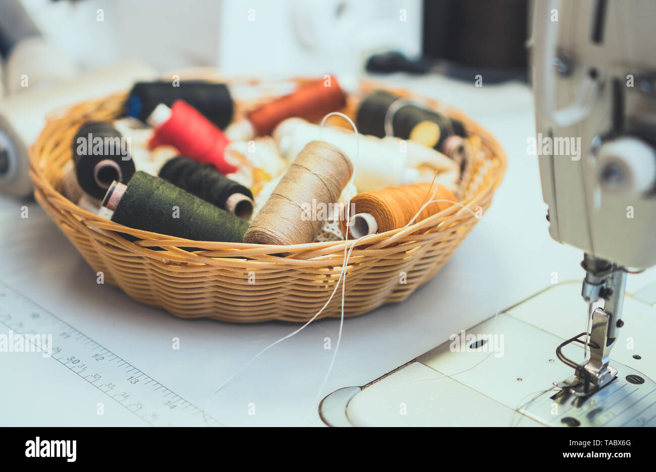 Sewing concept. Lot of thread coils next to the sewing machine Stock ...