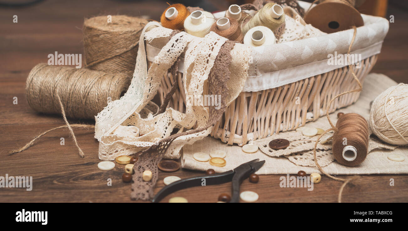 Sewing concept. Thread spools, buttons and sewing needles Stock Photo ...