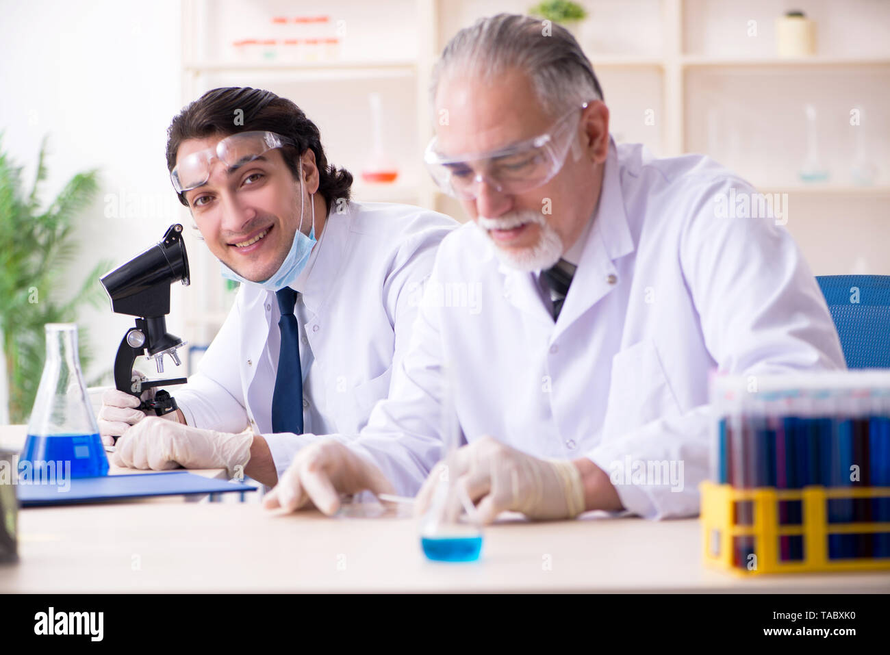 Two chemists working in the lab Stock Photo - Alamy