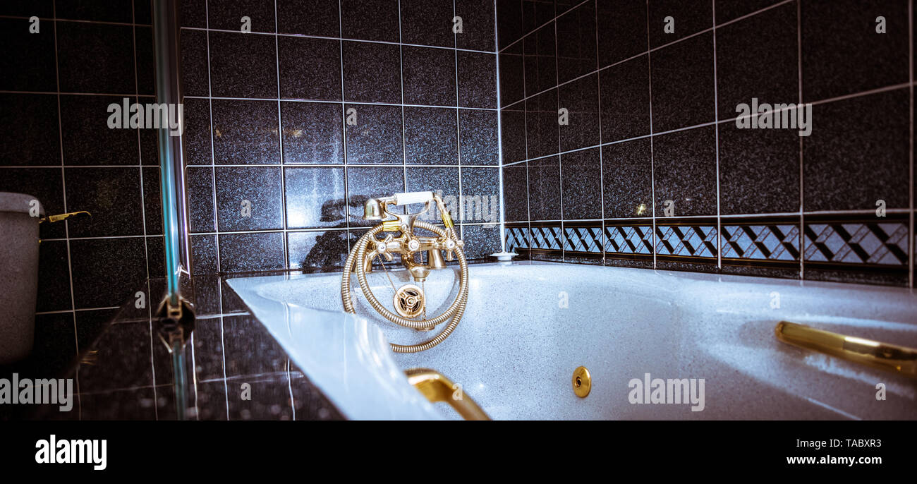 Brass vintage retro tap faucet - luxury bathroom with jacuzzi in modern ...