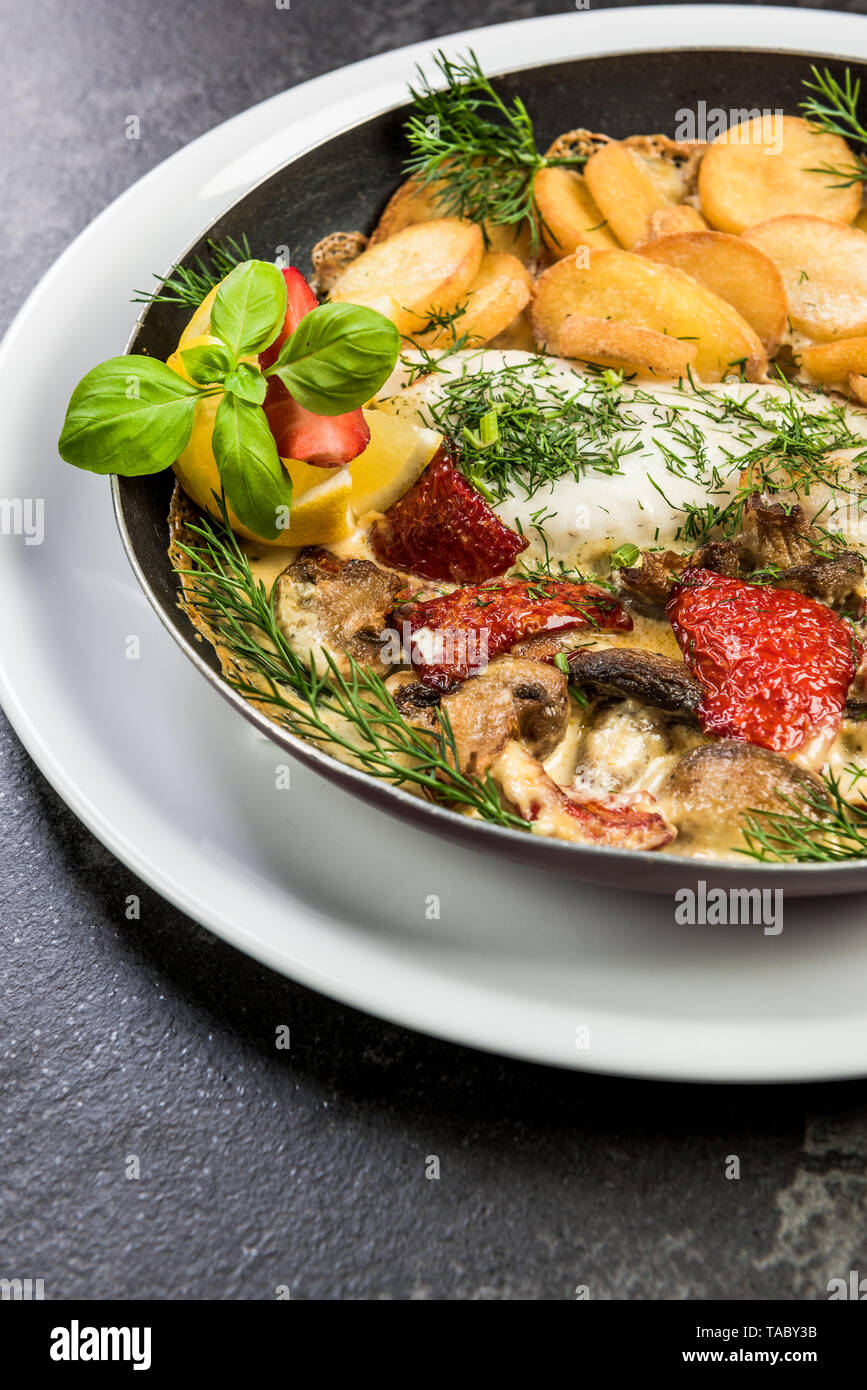 Grilled fish with fried potatoes, restaurant serving dish Stock Photo ...