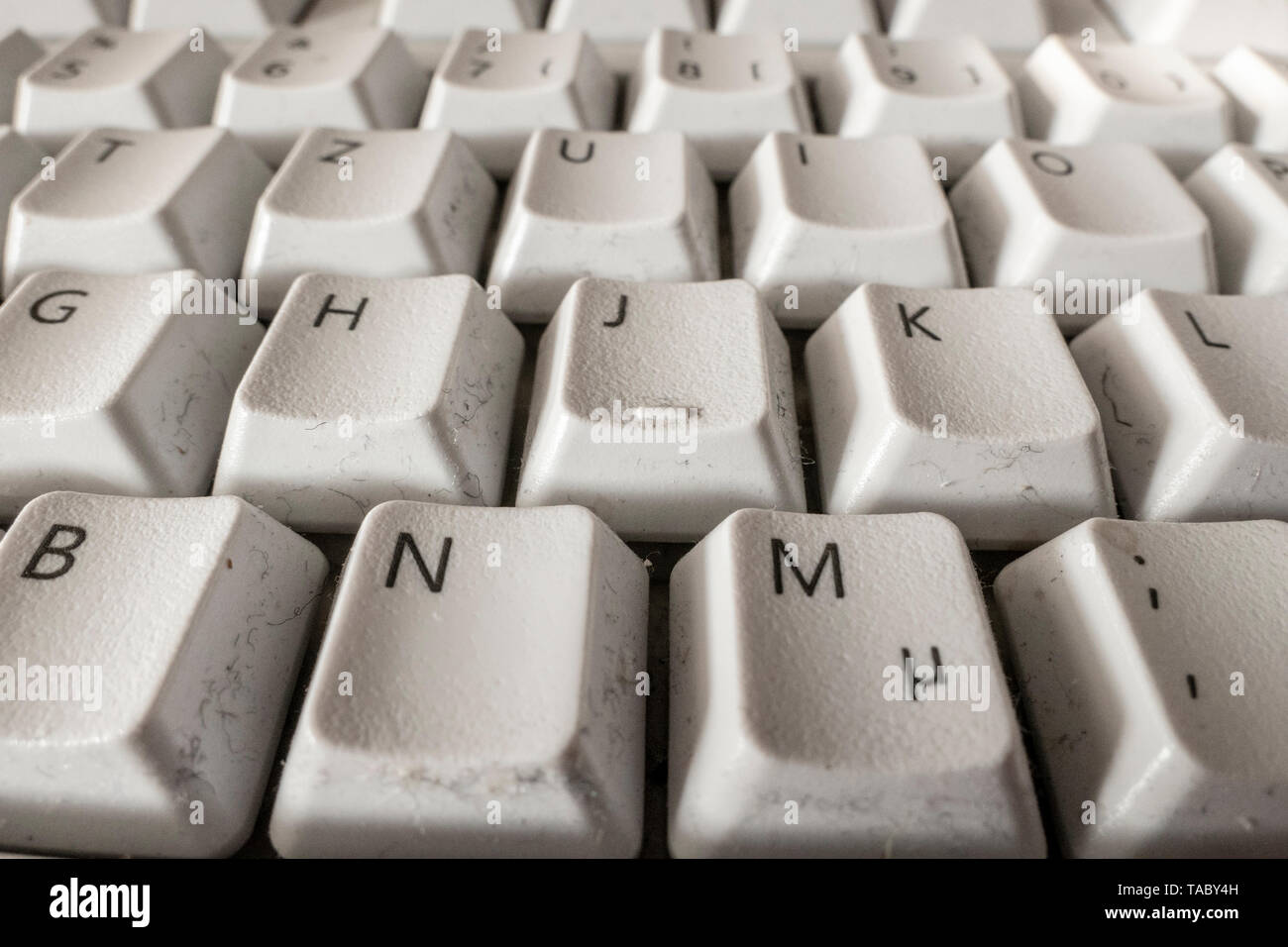 very dirty keyboard with the focus on the letters Stock Photo - Alamy