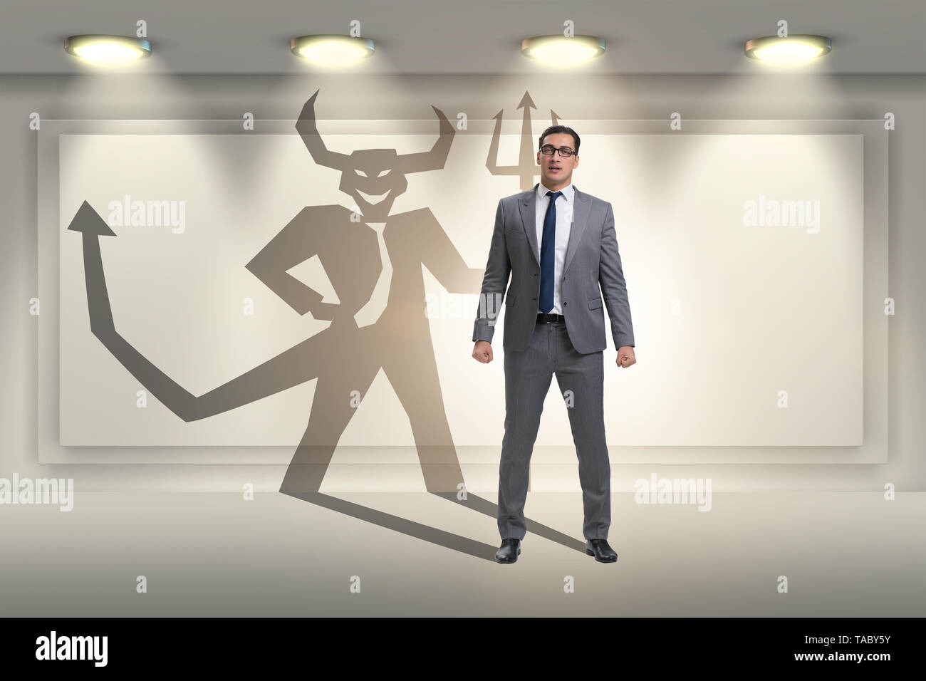 Devil hiding in the businessman - alter ego concept Stock Photo - Alamy