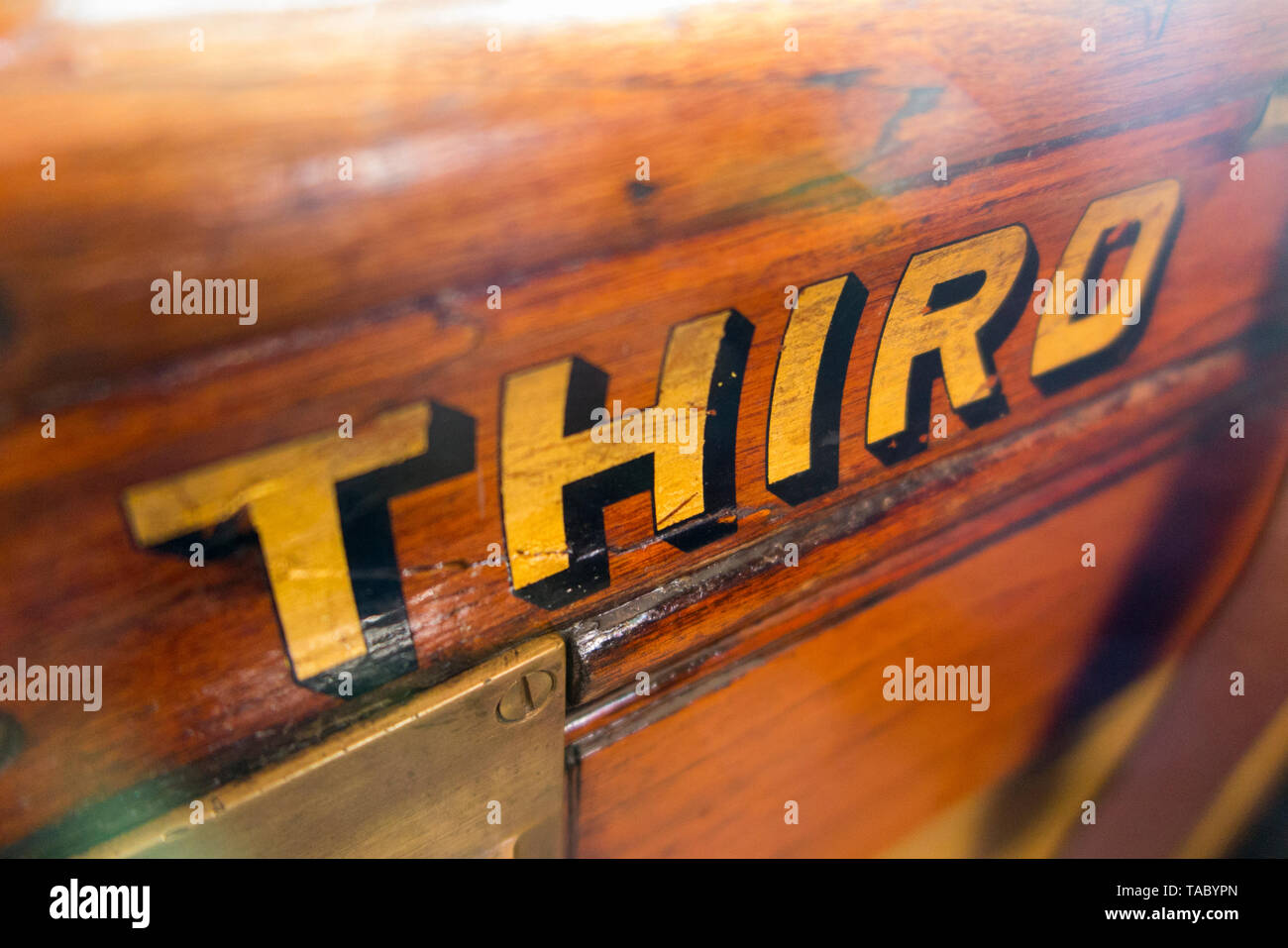 The word Third (class) painted in gold letters / lettering on the slam ...