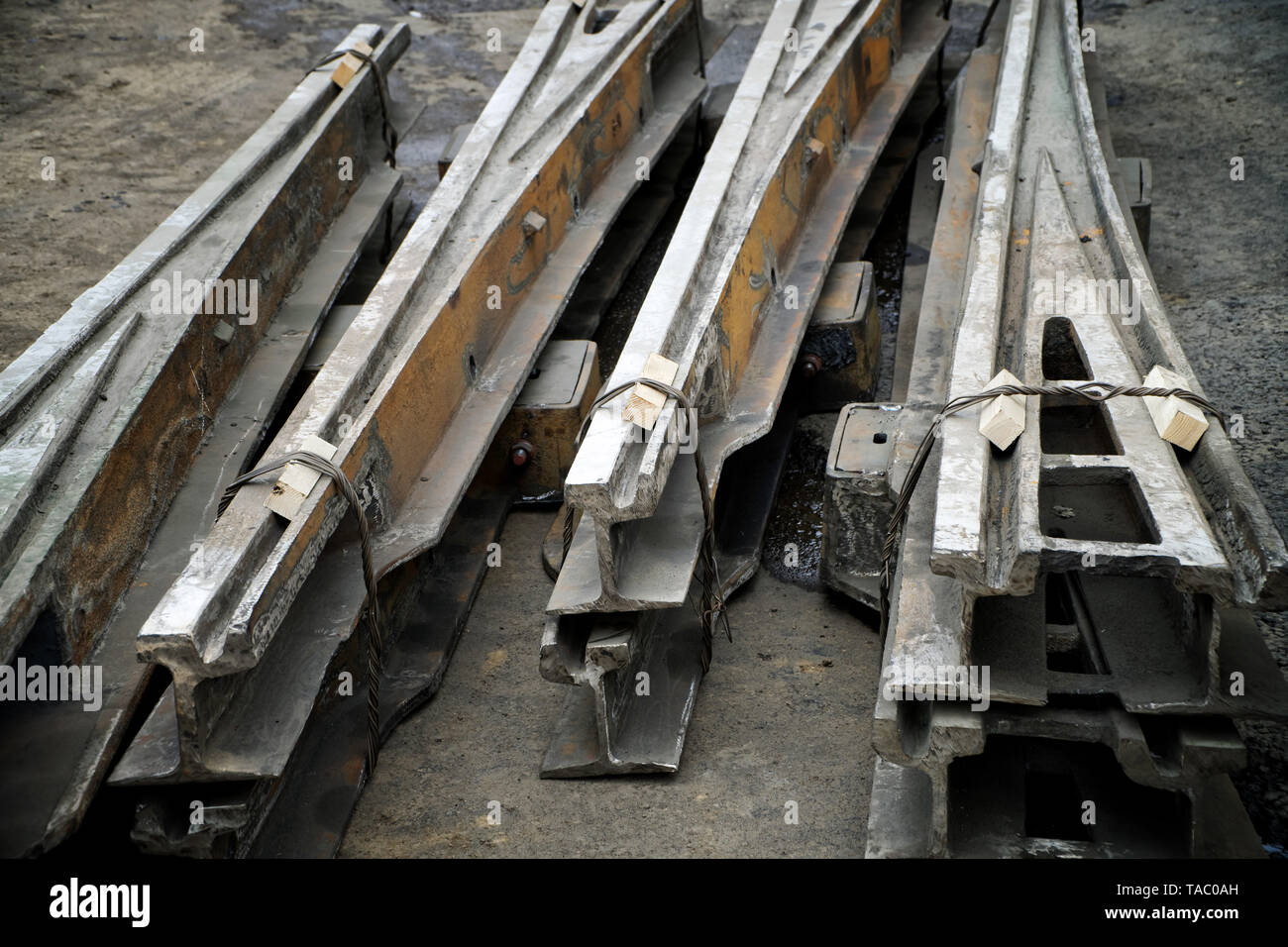 Old dismounted swivel tram rails lie on the asphalt. Roads and urban ...