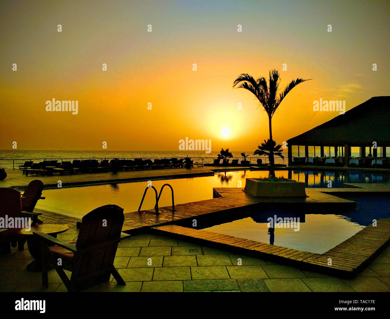 Beautiful poolside and sunset sky in Senegal, Africa. Luxurious ...