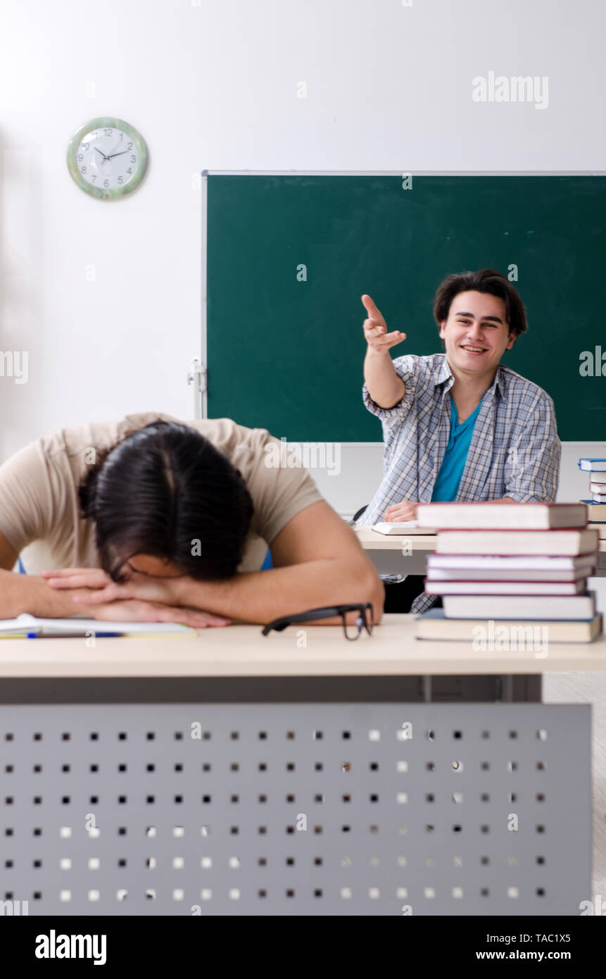 Two male students in the classroom Stock Photo - Alamy