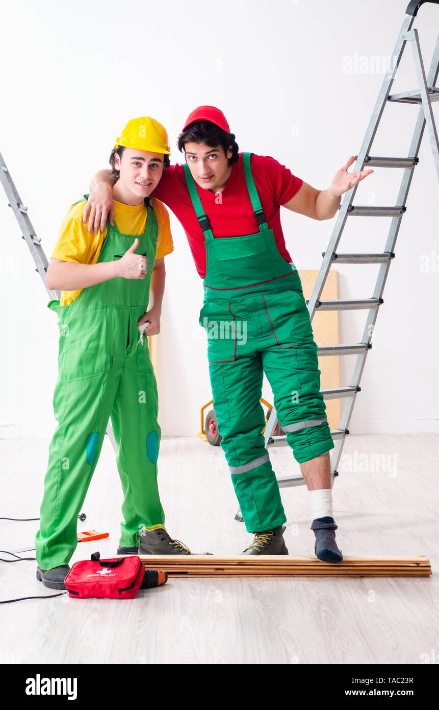 Injured worker and his workmate Stock Photo - Alamy