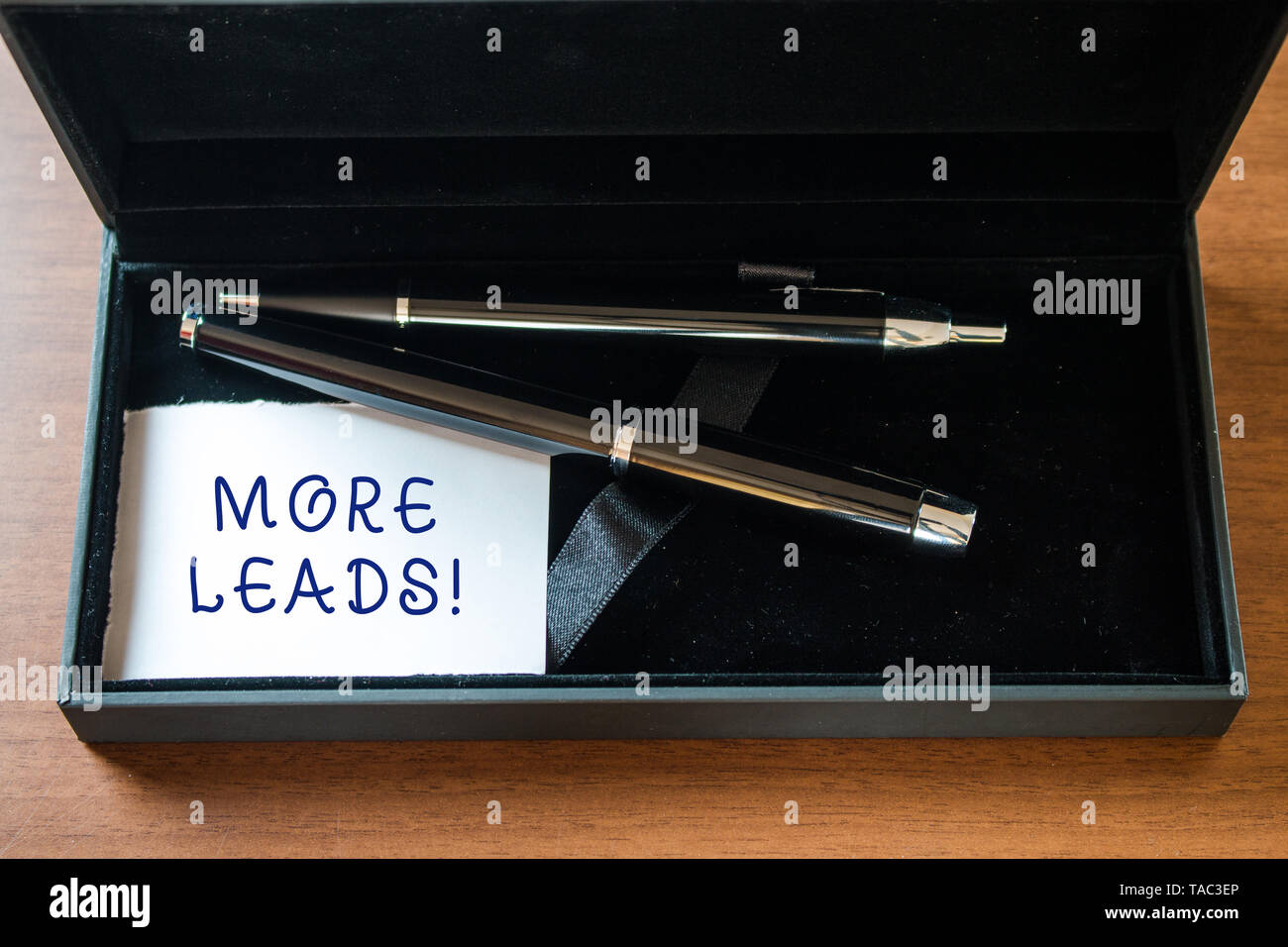Writing note showing More Leads. Business concept for initiation ...