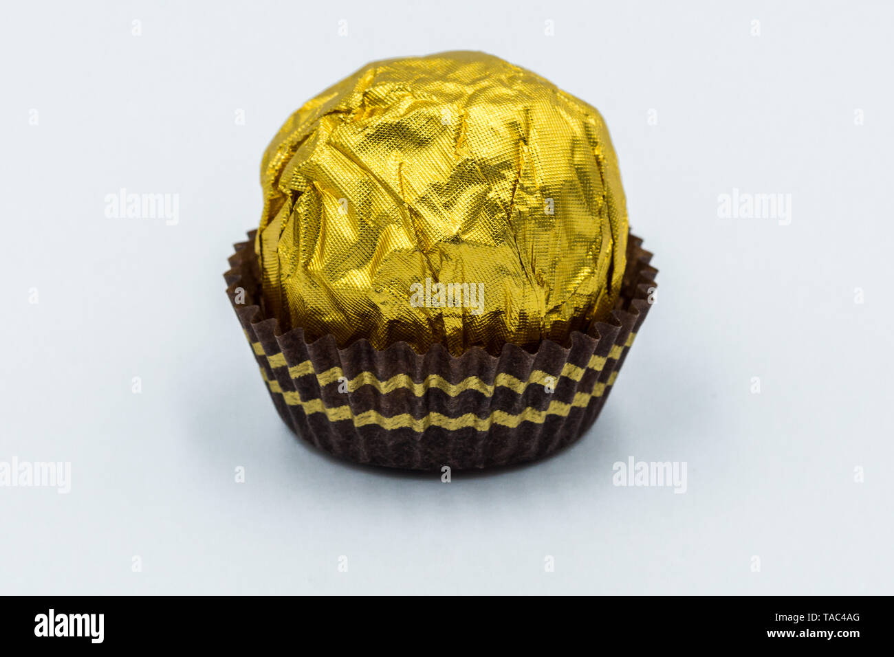 Chocolate wrapped in gold foil hi-res stock photography and images - Alamy