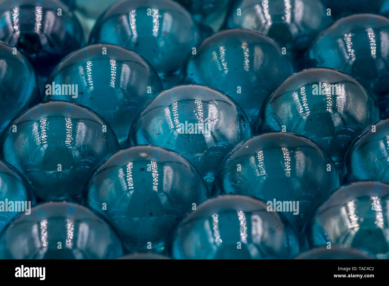 Glass colorful beads showing light reflection Stock Photo - Alamy