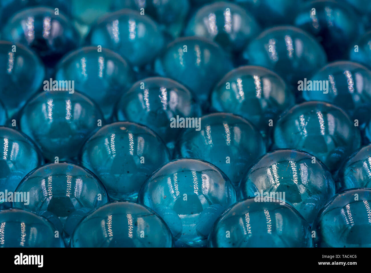 Glass colorful beads showing light reflection Stock Photo - Alamy