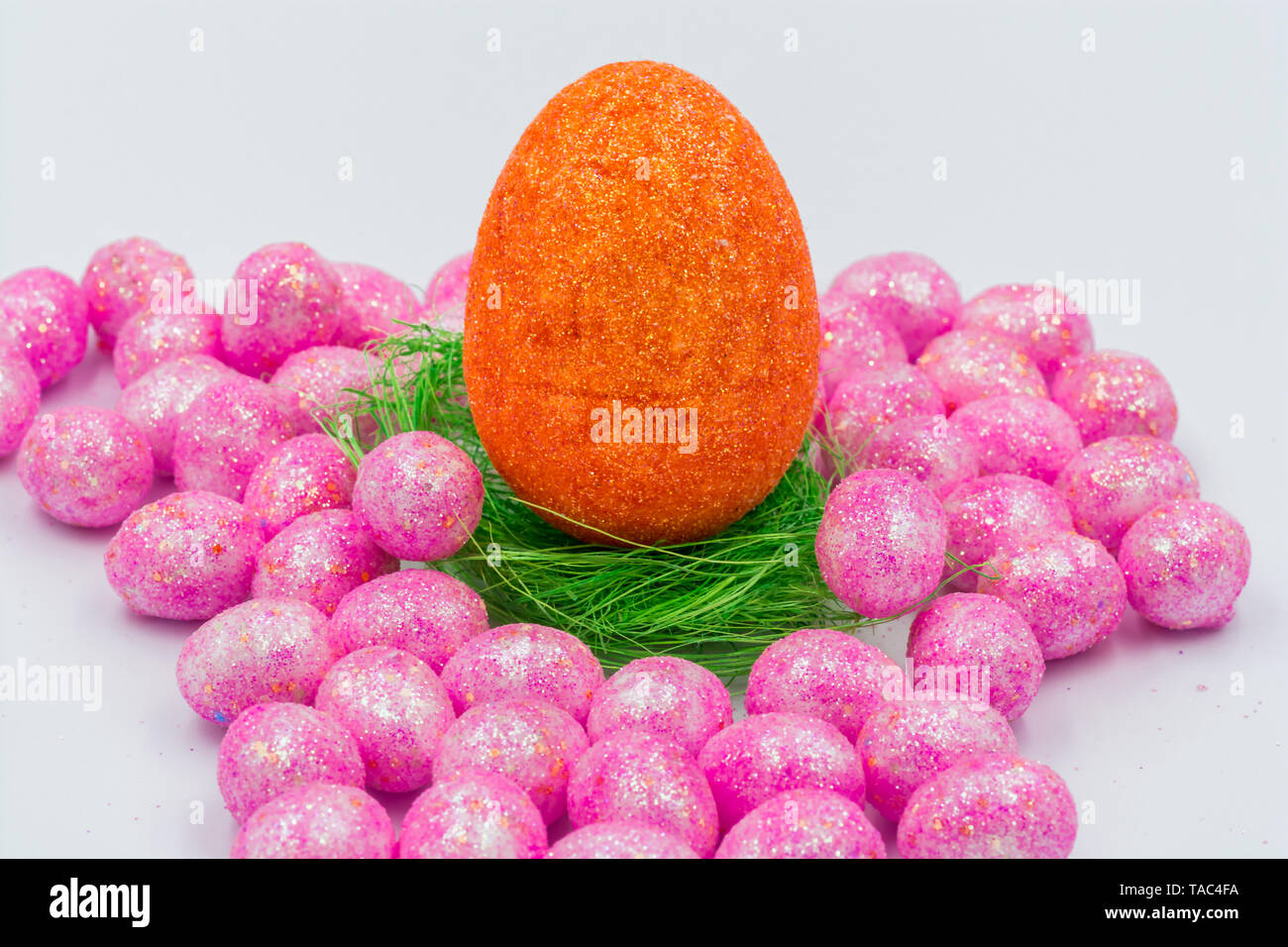 Easter props showing colorful easter egg, easter grass and mini eggs ...