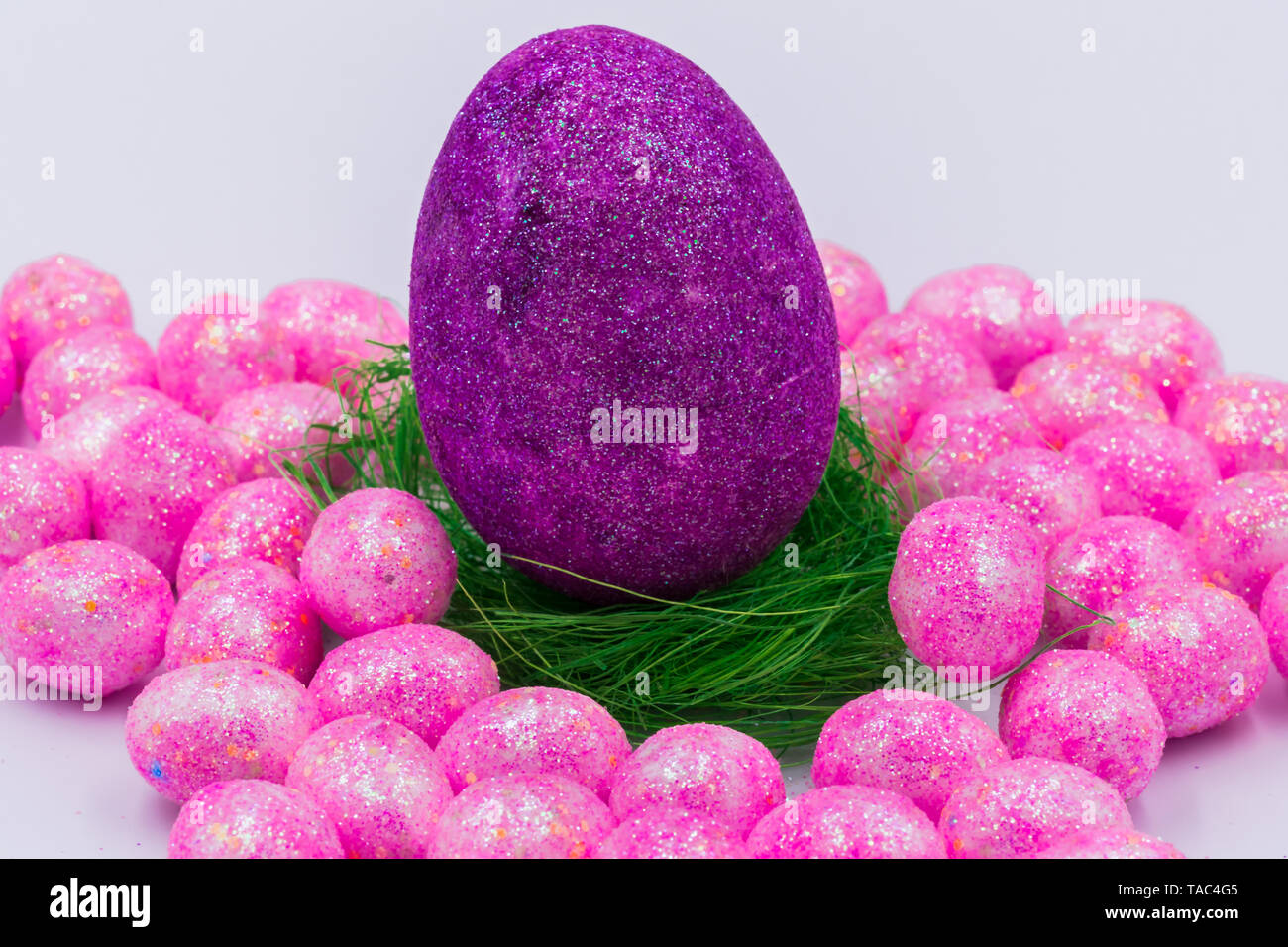 Easter props showing colorful easter egg, easter grass and mini eggs ...