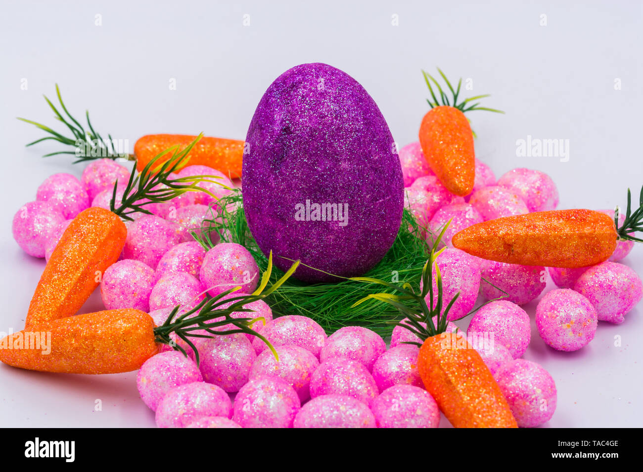 Easter props showing colorful easter egg, easter grass and mini eggs ...