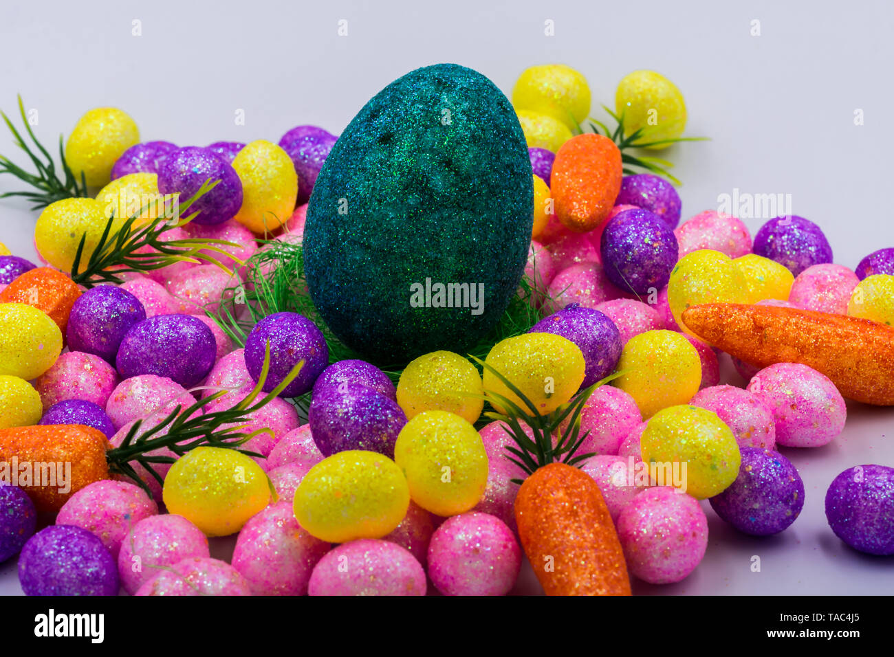 Easter props showing colorful easter egg, easter grass and mini eggs ...