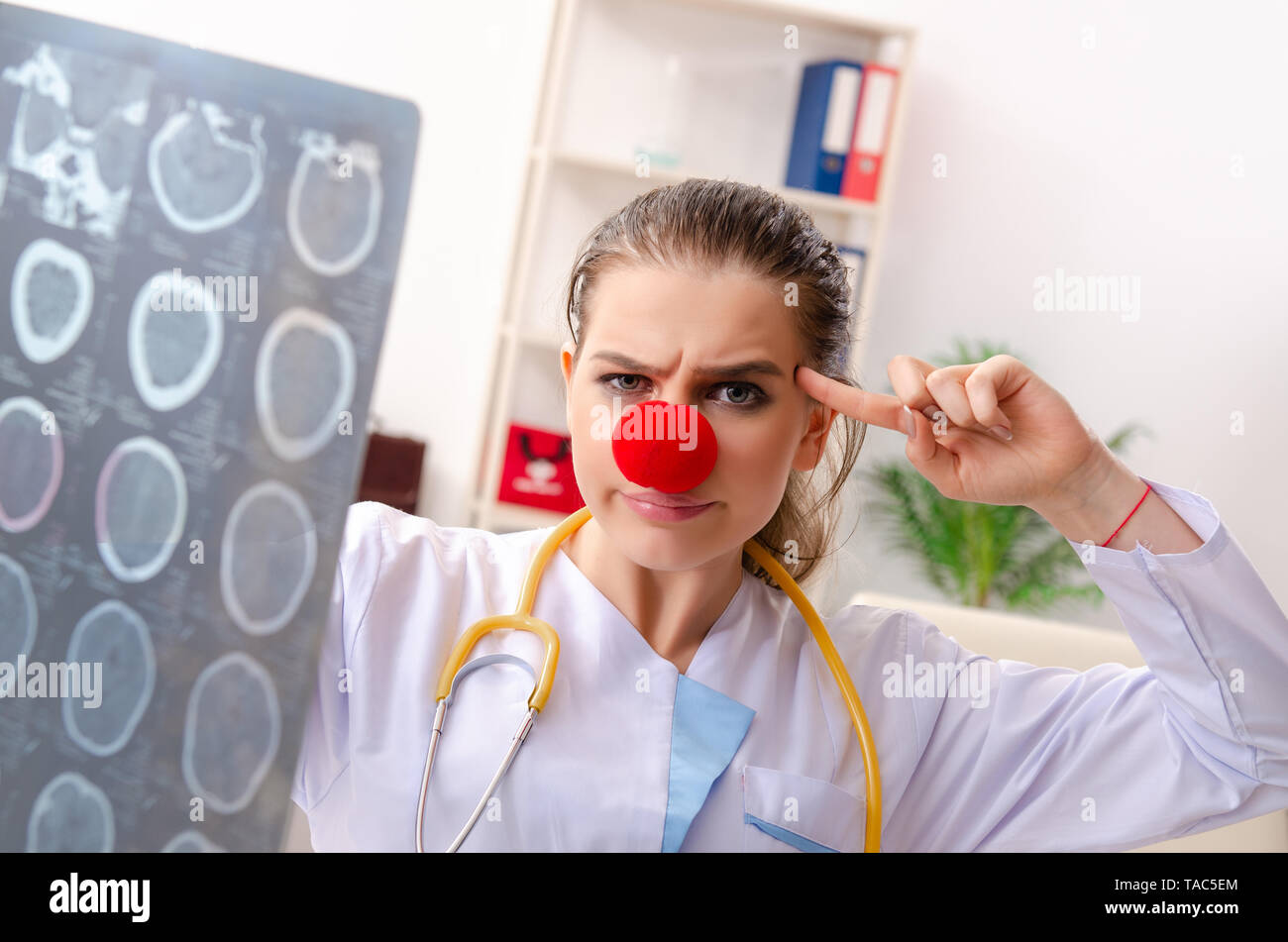 Funny female doctor working in the clinic Stock Photo - Alamy
