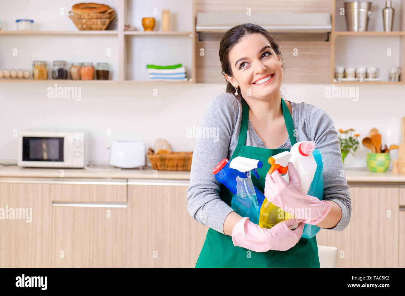 Young female contractor doing housework hi-res stock photography and ...