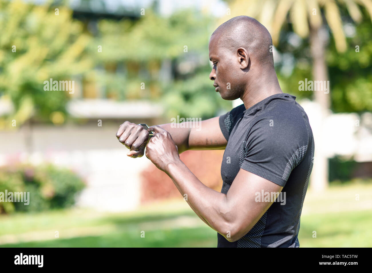 Runner checking smart watch fitness tracker hi-res stock photography ...