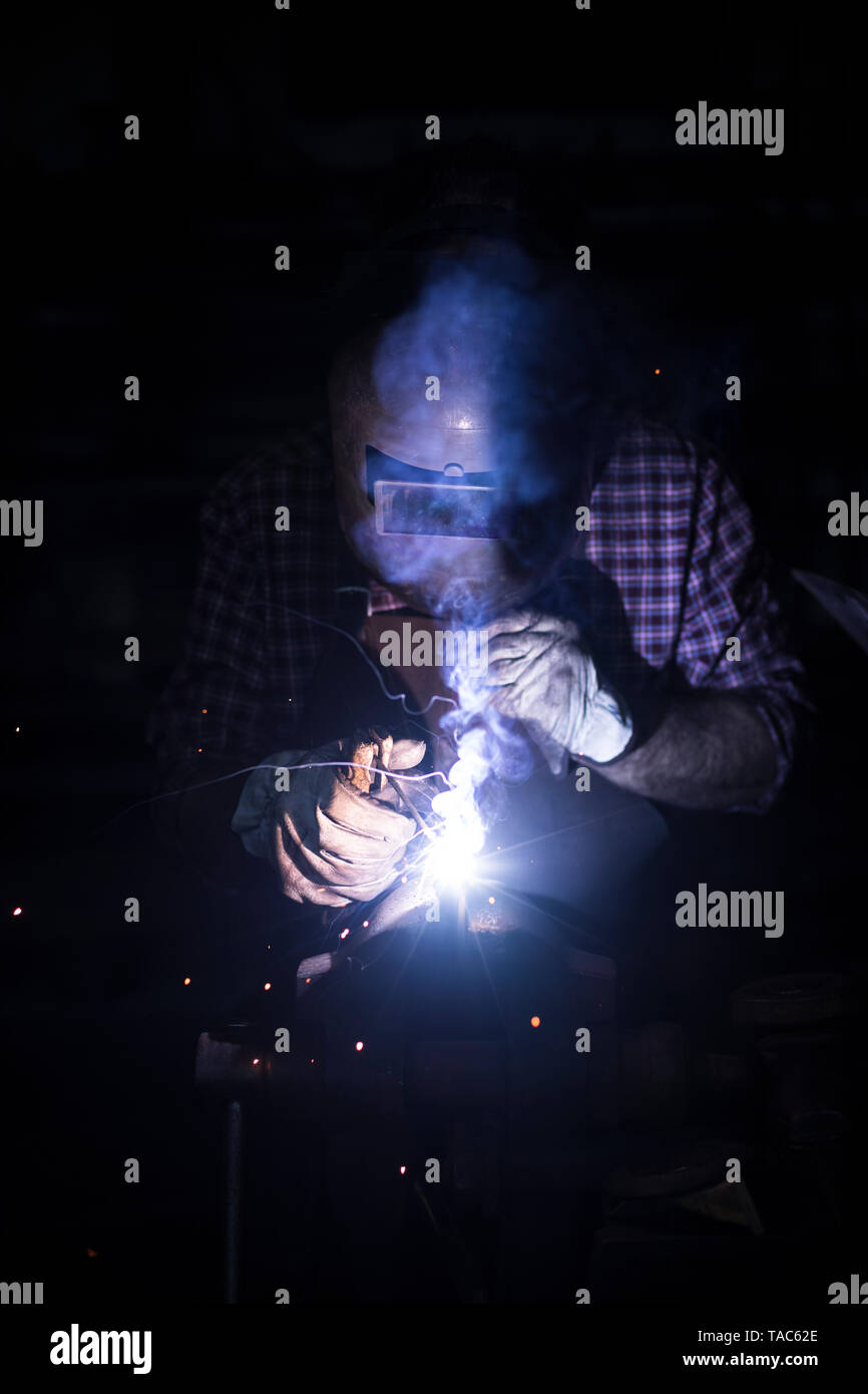 Man welding in his workshop Stock Photo - Alamy