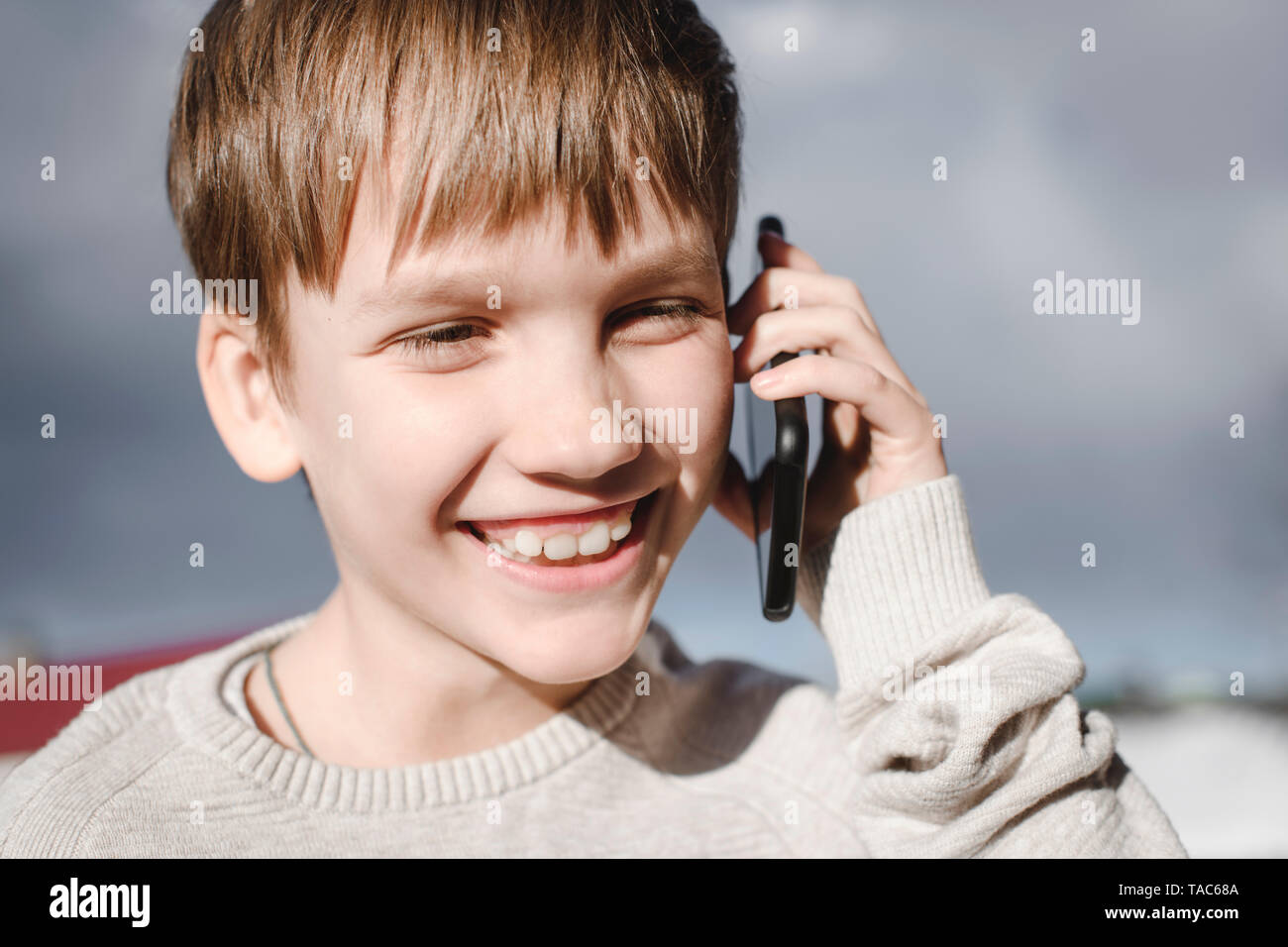 Boy with cell hi-res stock photography and images - Alamy