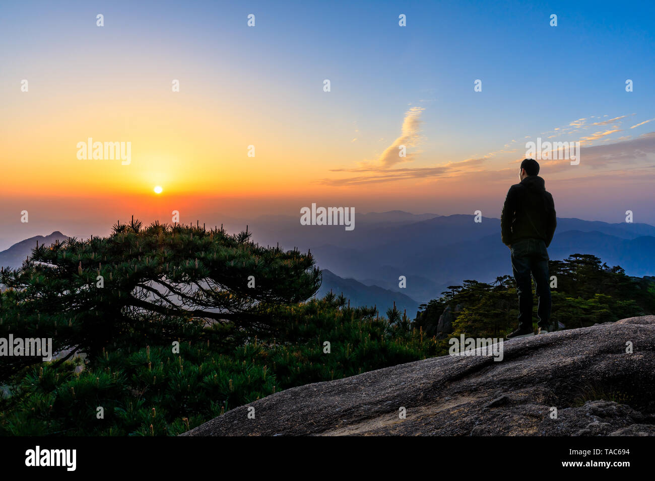 Man on top of mountain,conceptual scene Stock Photo - Alamy