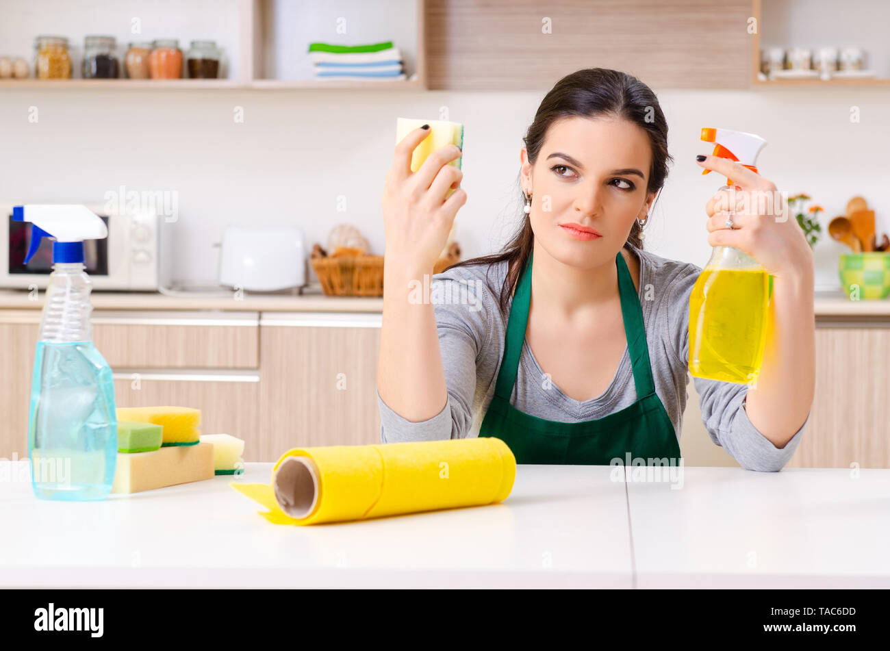 Young female contractor doing housework hi-res stock photography and ...