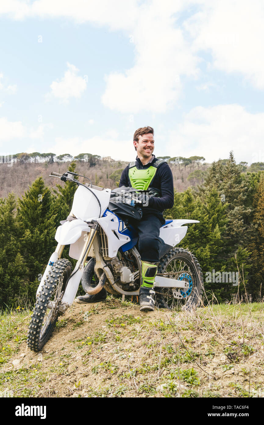 Portrait of confident motocross driver on circuit Stock Photo - Alamy
